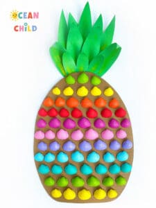 Shell craft for summer, DIY rainbow-colored pineapple - Ocean Child Crafts